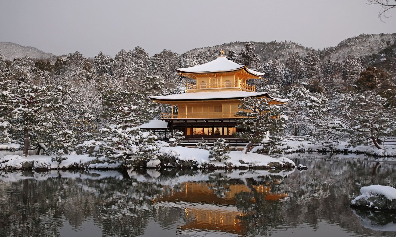 Vivid contrast of gold and white : snow-covered golden pavilion after ...